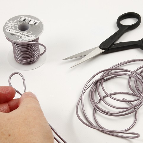 Braided Leather Bracelets with a Link Button Fastener