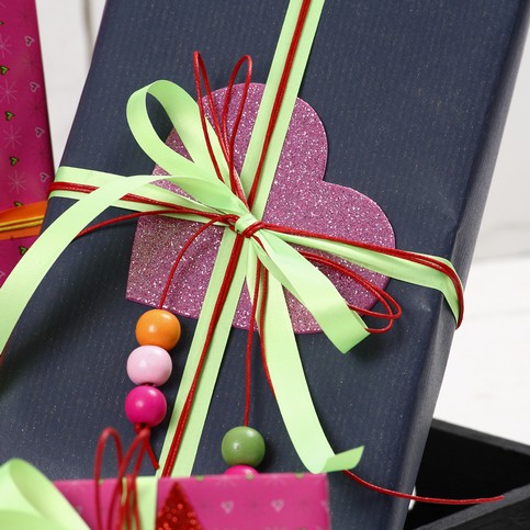 Gift Wrapping with Neon Coloured Ribbon and Foam Rubber with Glitter
